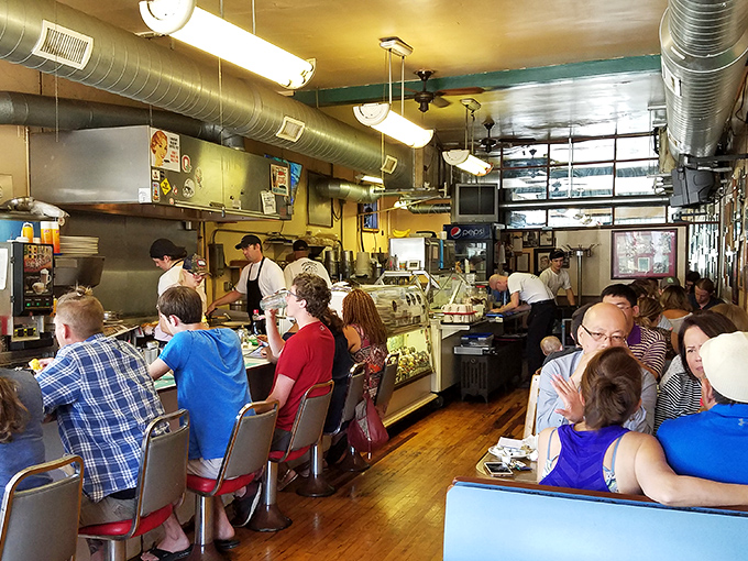 Where breakfast magic happens. The counter seating offers front-row tickets to the short-order symphony that plays daily.
