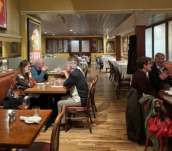 The dining room buzzes with that perfect blend of conversation and clinking glasses – the soundtrack to memorable meals everywhere.
