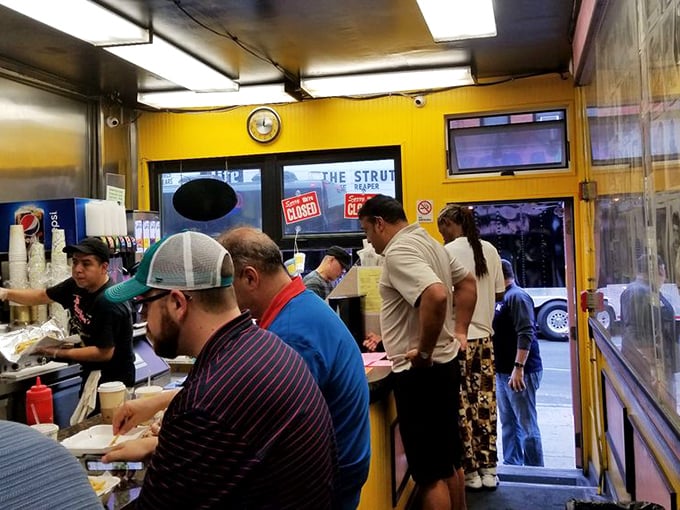 The line forms with purpose—locals and visitors united in the universal language of "I need that cheesesteak right now."