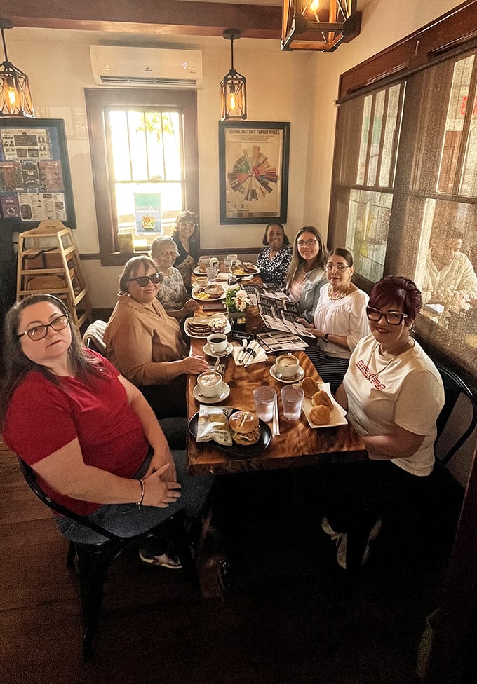 The true measure of a great café: tables filled with happy diners sharing stories and food. Community happens naturally when the coffee's this good.