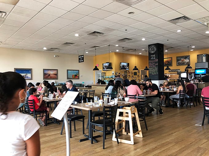A bustling dining room where strangers become friends over shared maple syrup recommendations. The breakfast club you actually want to join.