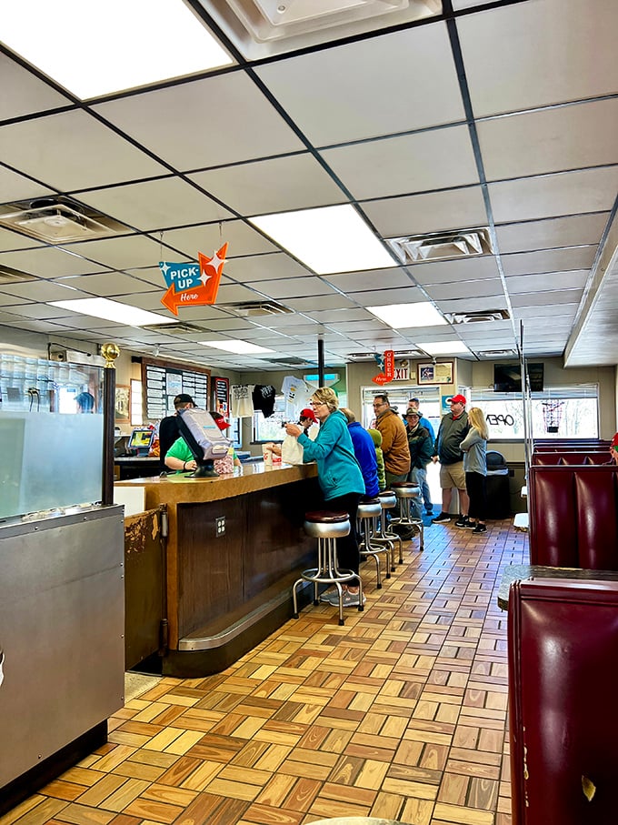 The lunch counter ballet – regulars and first-timers alike performing the time-honored ritual of anticipation.