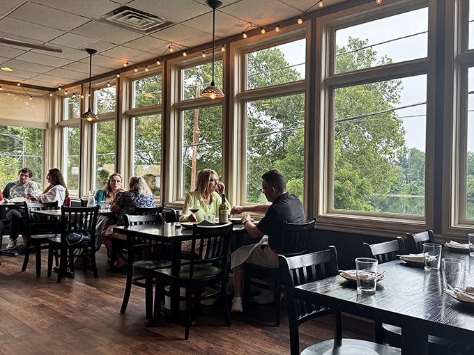 The wall of windows doesn't just let light in—it transforms an ordinary meal into a dining experience with a side of people-watching.
