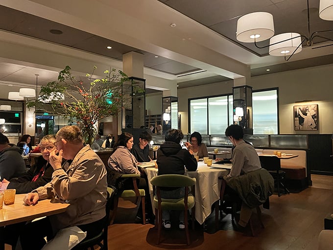 The dining room hums with that perfect blend of energy and intimacy – where strangers' laughter becomes part of your own dining soundtrack.