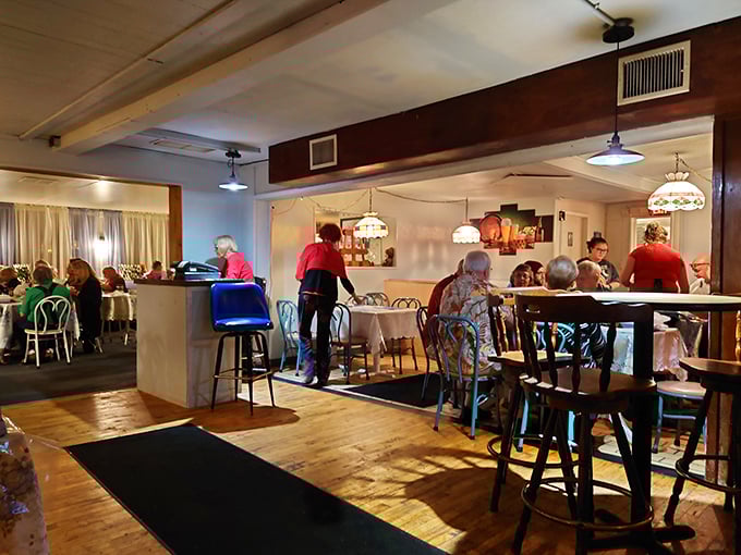Where food brings strangers together. The warm lighting and traditional decor create the perfect backdrop for making memories over schnitzel.