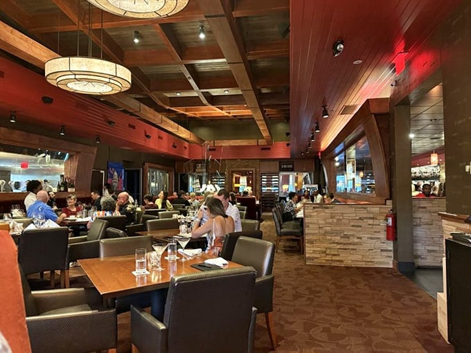 The warm glow of conversation and culinary anticipation fills the room. Every table holds the promise of imminent deliciousness.