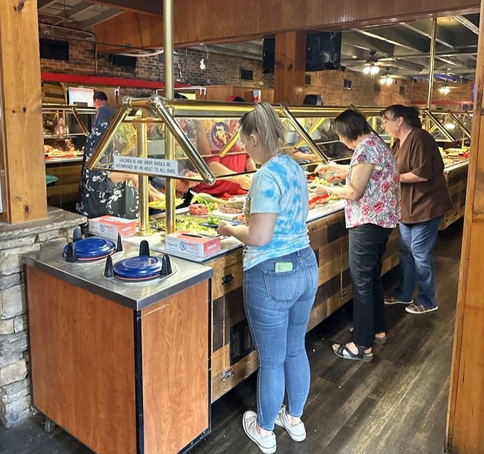 The buffet pilgrimage in progress. Notice the focused expressions—this isn't their first rodeo at Austin's legendary spread.