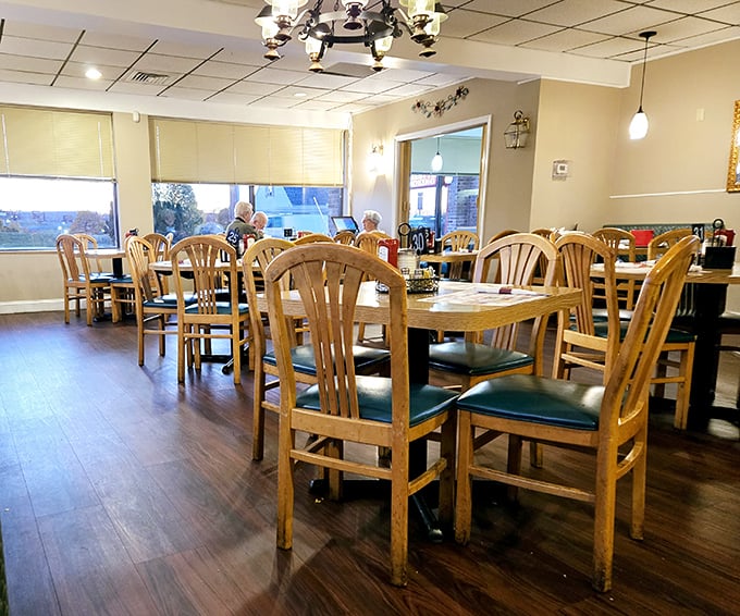 Wooden chairs and warm lighting create that "everybody knows your name" feeling. The diner's dining room—where strangers become regulars.