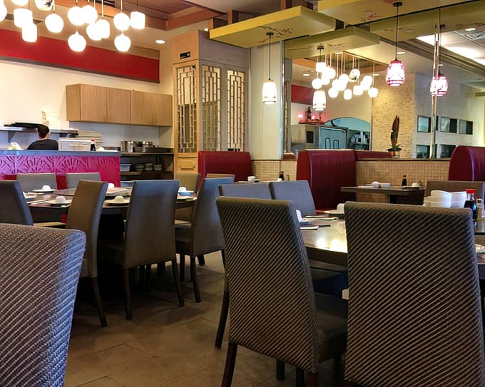 Modern meets traditional in this dining space where family-style tables await multi-generational feasts and inevitable food envy.