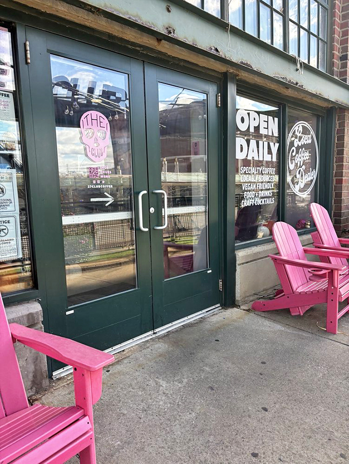 Green doors, pink chairs—a color combination that shouldn't work but absolutely does, like pineapple on pizza or The Rolling Stones after 60.