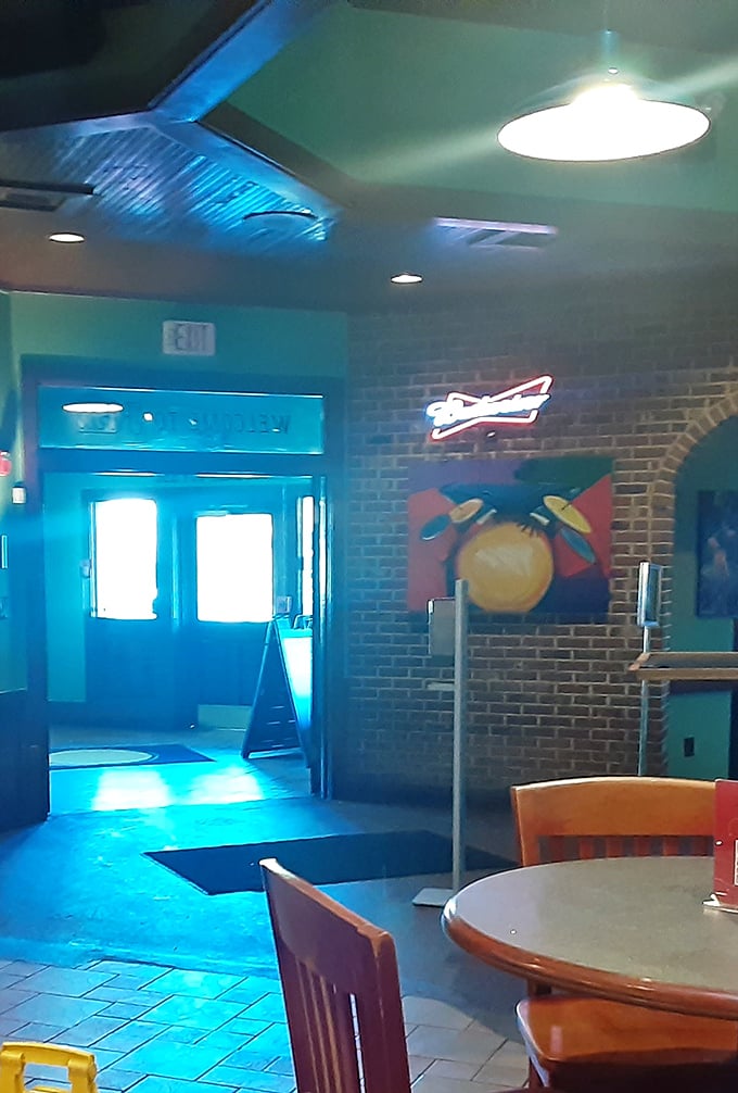 Art meets appetite near the entrance, where colorful paintings and neon signs remind you this isn't just eating—it's an experience.