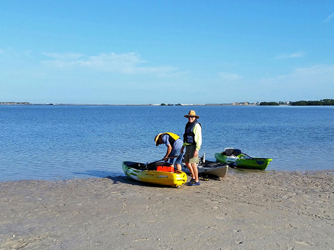 Kayakers preparing for adventure, because sometimes the best perspective comes from water level.