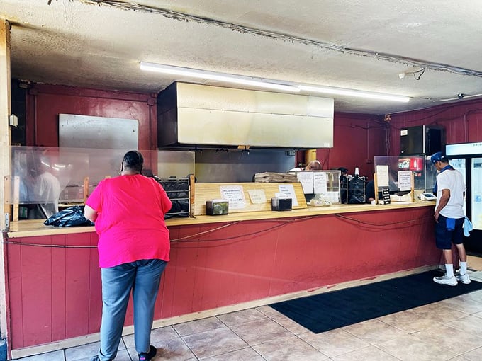 The ordering counter—where dreams are placed and smoky realities are returned. Notice the lack of pretense and abundance of efficiency.