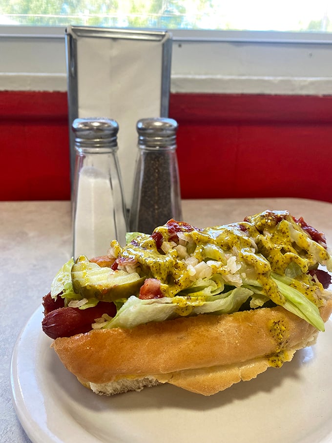 This isn't just a hot dog—it's a canvas of culinary creativity topped with enough goodies to make Oscar Mayer weep with pride.