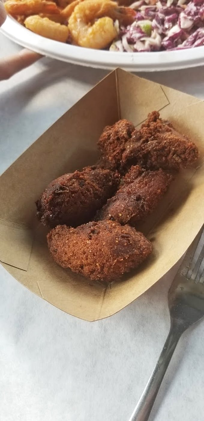 These hush puppies aren't just side dishes – they're golden orbs of cornmeal perfection that could easily become your main event.
