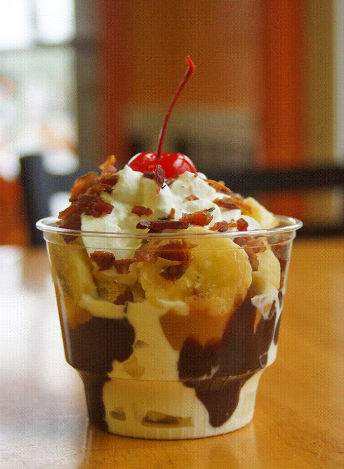 Layers of ice cream, hot fudge, and banana create a sundae that's basically therapy in a cup. The cherry on top isn't optional—it's essential.