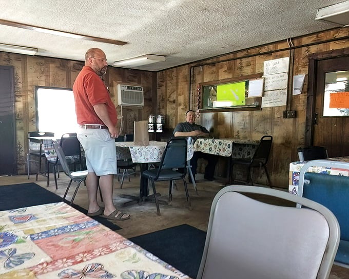 Two patrons sharing the sacred space of a true BBQ temple. No dress code required—just bring your appetite.