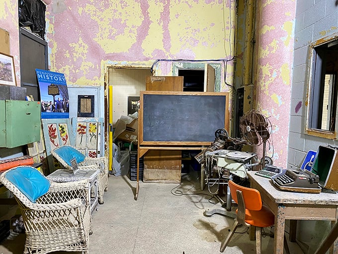 Remnants of daily life—a chalkboard, wicker chairs, and vintage fan—create a time capsule that's both fascinating and deeply poignant.