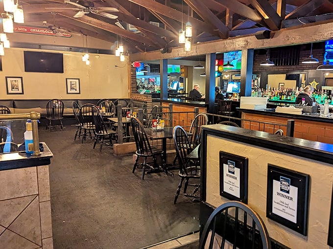 The dining room balances rustic charm with modern comfort – where exposed beams meet flat screens, and nobody's complaining.