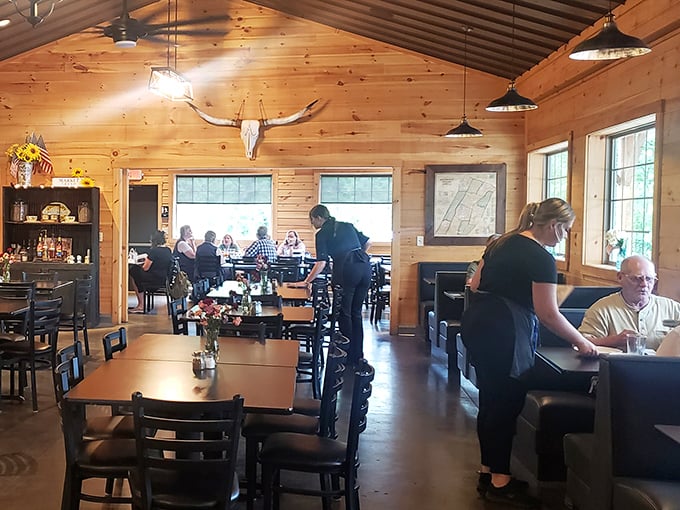 The vaulted ceiling and rustic wooden interior create an atmosphere that's simultaneously spacious and intimate—like dining in an upscale mountain cabin.