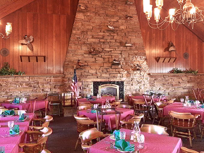 That stone fireplace isn't just architectural—it's the beating heart of a dining room where generations have celebrated life's big moments over prime rib.