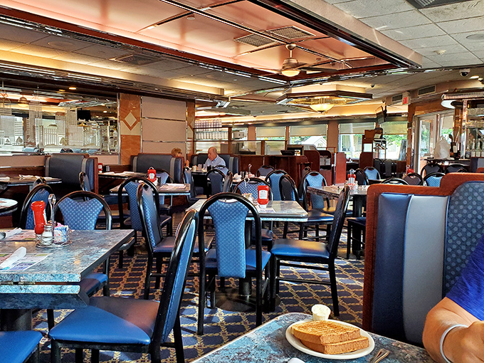 Blue chairs and wooden tables create the perfect backdrop for life's important moments—like deciding between pie or rice pudding for dessert.