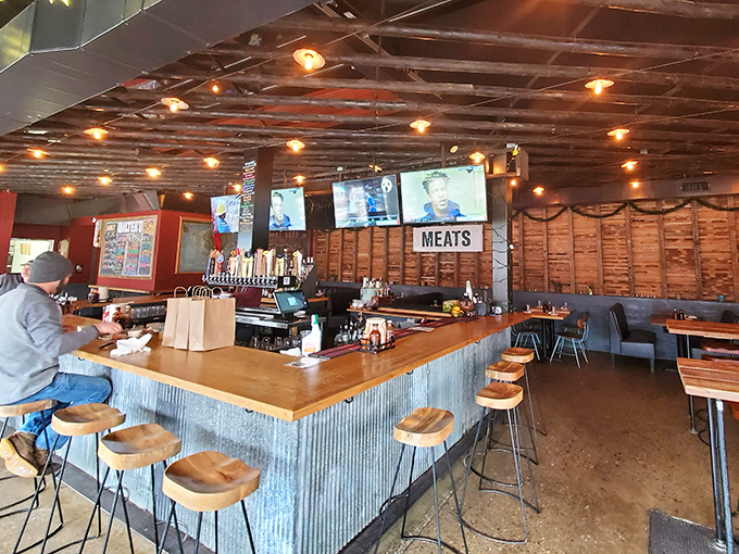 The bar area combines industrial chic with barbecue functionality—a place where "MEATS" isn't just a sign, it's a philosophy.