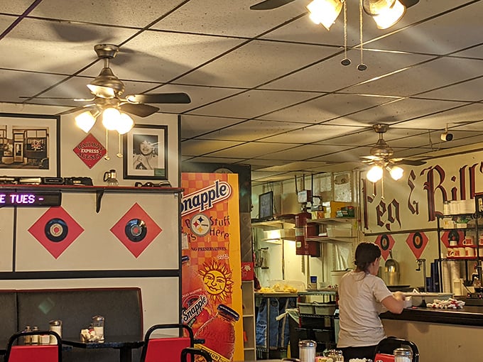 Ceiling fans lazily spinning above a room where conversations flow as freely as the coffee—diner ambiance you can't manufacture.
