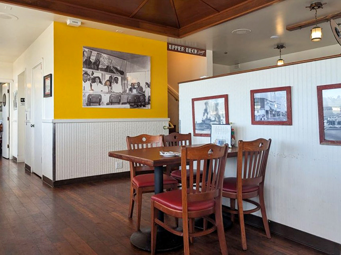 Historic photos watching over diners like seafood-loving guardian angels keeping traditions alive and delicious.