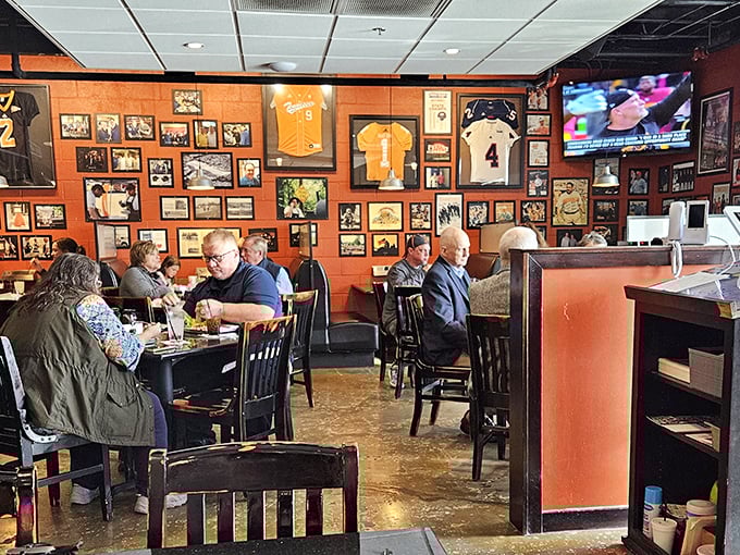 Every inch of wall space tells a story, with Tennessee orange making it clear exactly which team this restaurant roots for on Saturdays.
