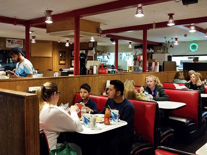 The heart of Skyline – where wood paneling, red booths, and checkered tablecloths create the backdrop for countless Portland dining memories.