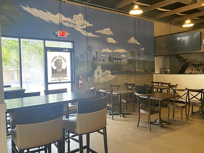 The mural of clouds against blue walls creates an atmosphere that says, "Stay awhile, the outside world can wait until after dessert."