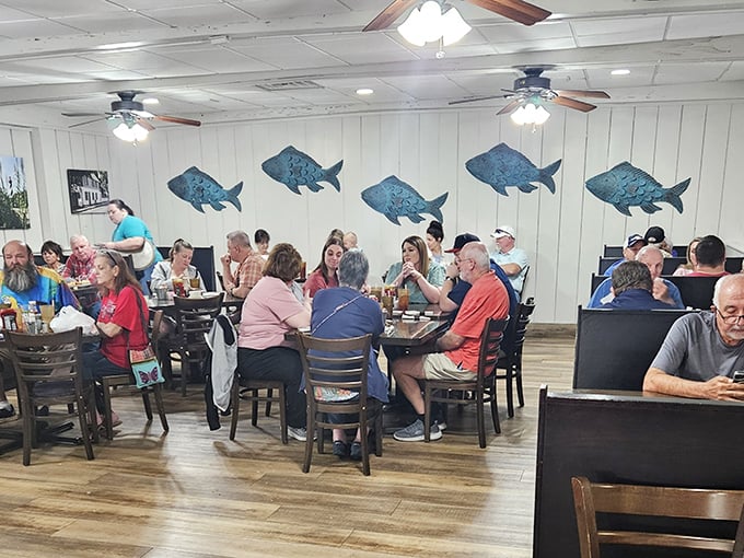 Those blue fish decorations aren't just whimsical wall art—they're basically pointing to your plate saying, "This is where our friends ended up, and you'll be glad they did."