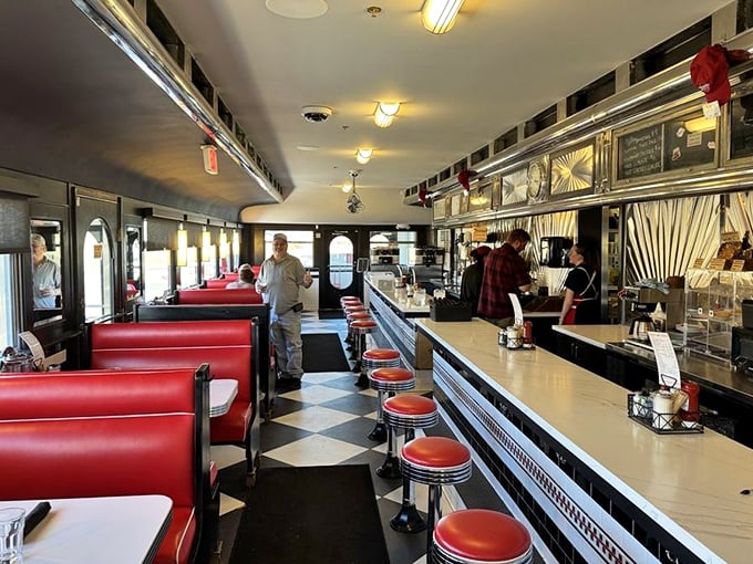 Classic diner design at its finest—where red booths meet chrome accents, and the counter stretches like a runway for plates of comfort food.