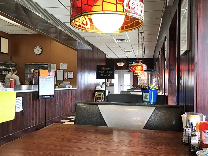 Where wood paneling isn't retro—it's just never gone out of style. The "Please Wait To Be Seated" sign might as well say "Good Things Come To Those Who Wait."