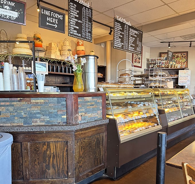 The display case—or as I like to call it, "The Museum of Delicious Decisions." Each pastry patiently waits its turn to change someone's day.