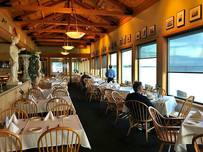 White tablecloths and wooden chairs create an unpretentious elegance, while those windows frame nature's best artwork—the bay itself.