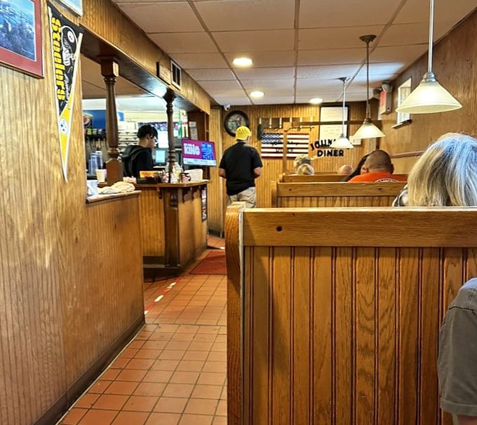 Wood paneling and booth seating – where comfort food meets comfortable seating in perfect diner harmony.