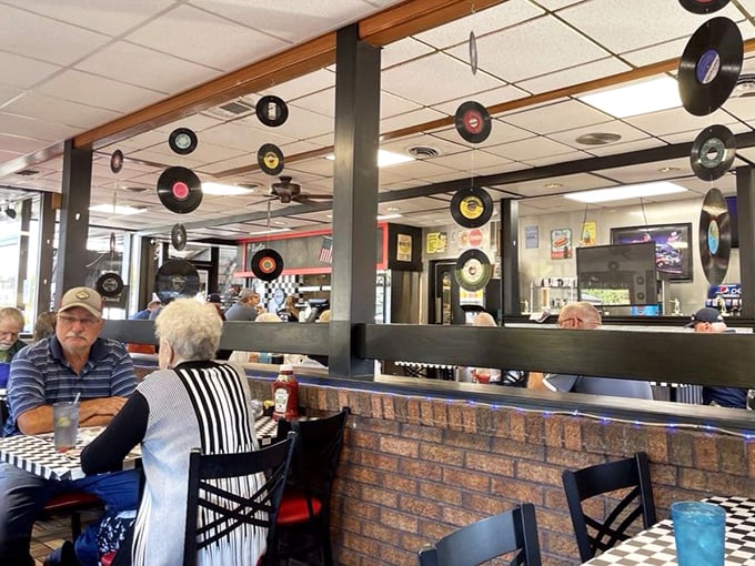 The dining room where vinyl records aren't just decoration but conversation starters—"Remember this one?" is heard as often as "Pass the ketchup."