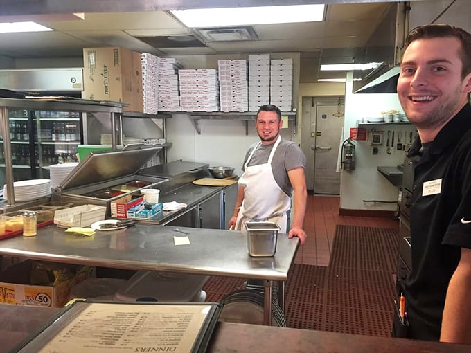 A glimpse into the kitchen where the magic happens, with staff who clearly enjoy their craft.