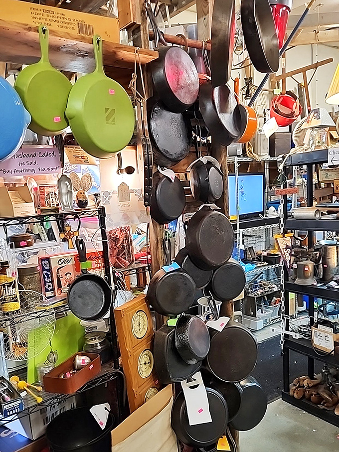 Cast iron pans hanging like dark medals of culinary honor – each one seasoned with decades of family dinners and Sunday morning pancakes.