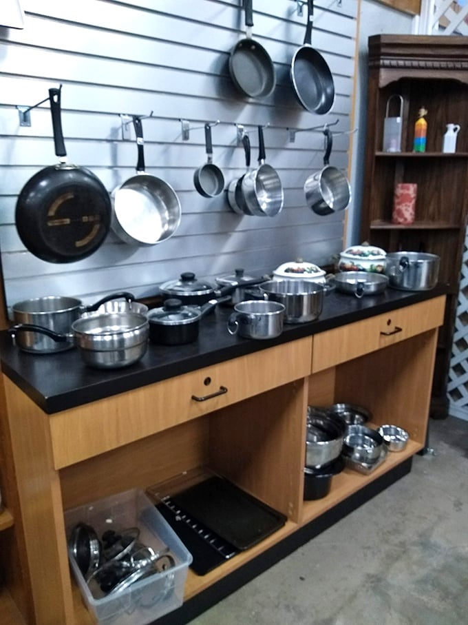 The cookware section – where professional-grade pots hang out with quirky vintage pans, waiting for their next culinary adventure.