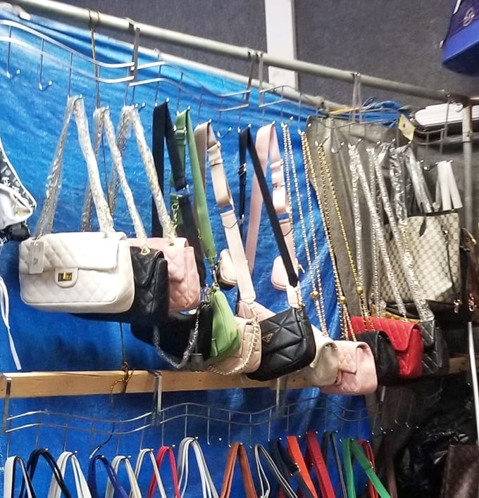 Handbags suspended like fashionable fruit, ripe for the picking. Designer-inspired without designer prices—the sweet spot of flea market fashion.
