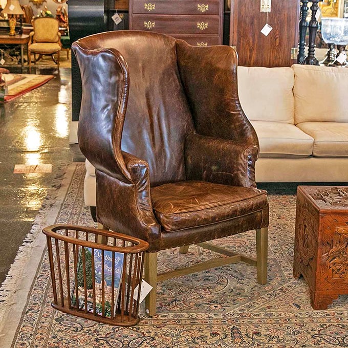 This leather wingback isn't just a chair—it's a throne waiting for someone who appreciates the perfect patina that only comes with time.