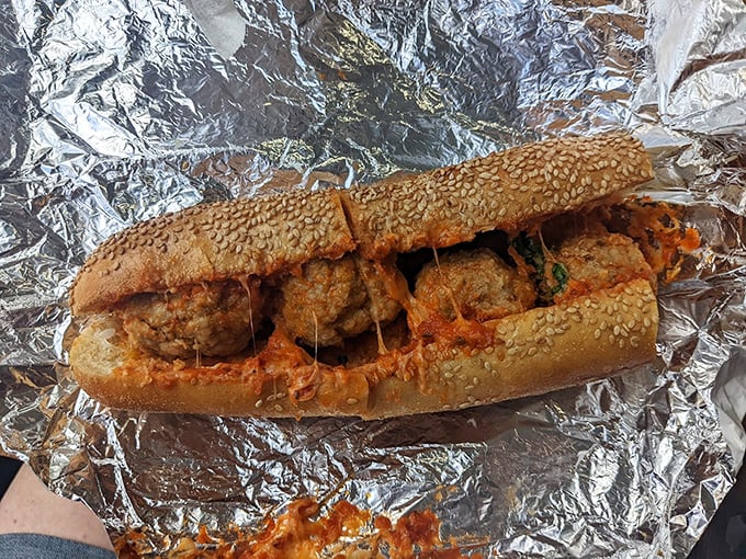 Meatballs that could make a vegetarian weep with temptation. The sauce-soaked roll is merely a vessel for these magnificent orbs of flavor.