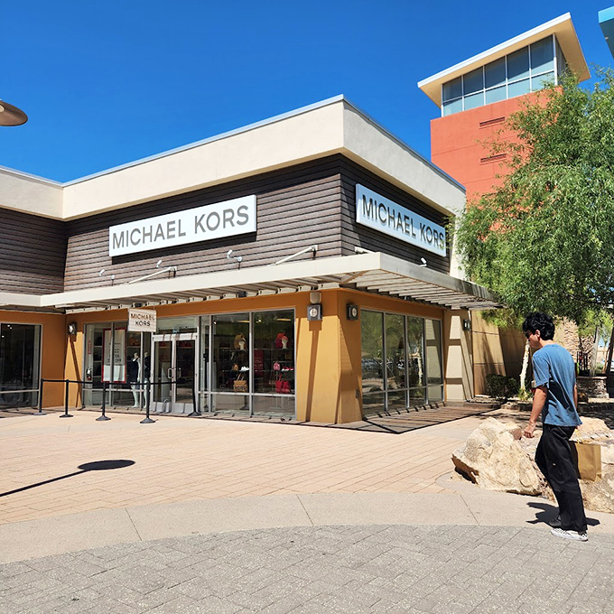 Michael Kors stands sentinel in the desert sun, its clean lines and earth tones blending Southwestern architecture with New York fashion sensibilities.