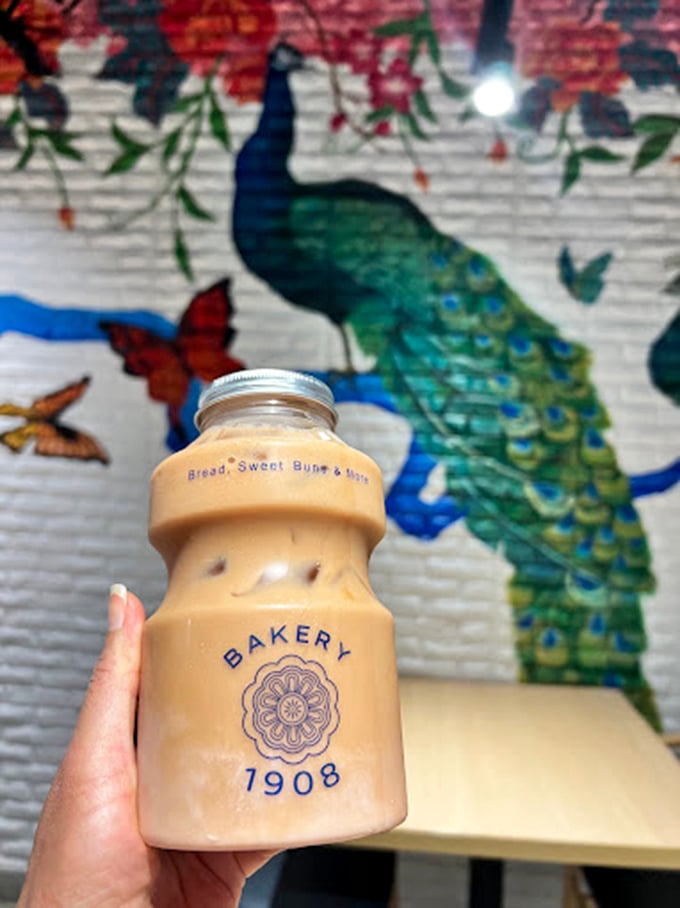 Their signature milk tea, served in an adorably branded bottle, makes the perfect companion for admiring that stunning peacock mural.