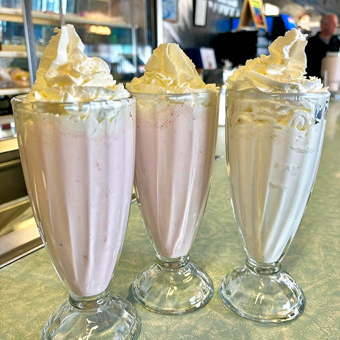 Milkshakes topped with whipped cream mountains—thick enough for a spoon, satisfying enough to make you forget about your diet entirely.