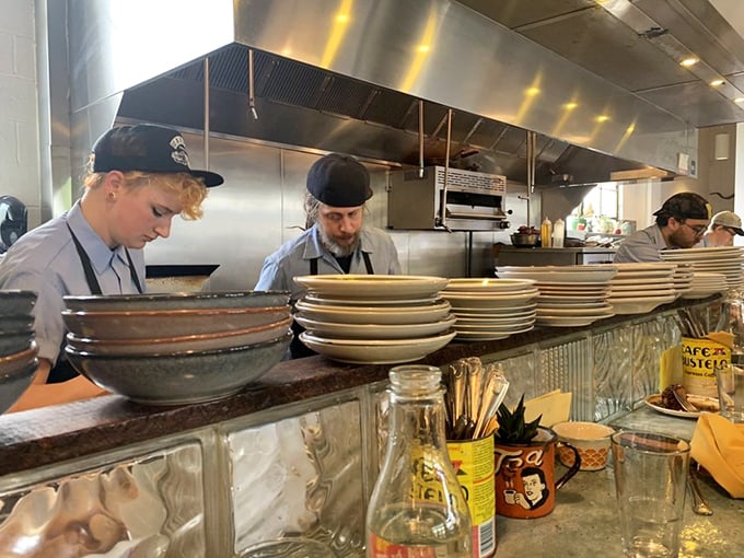 The kitchen crew works their magic in plain view—culinary transparency that adds seasoning to the experience beyond just salt and pepper.