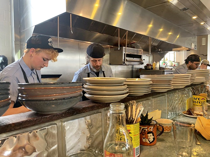 The kitchen crew works their magic in plain view—culinary transparency that adds seasoning to the experience beyond just salt and pepper.